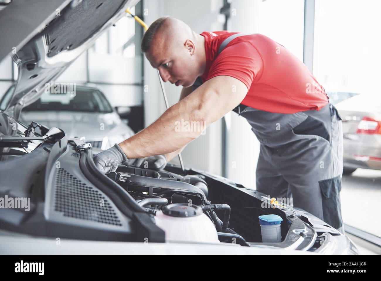 Auto mechanic working in garage. Repair service Stock Photo - Alamy