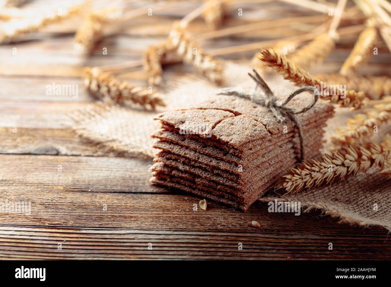 Rye crackers and ears on a old wooden table. Healthy organic food Stock ...