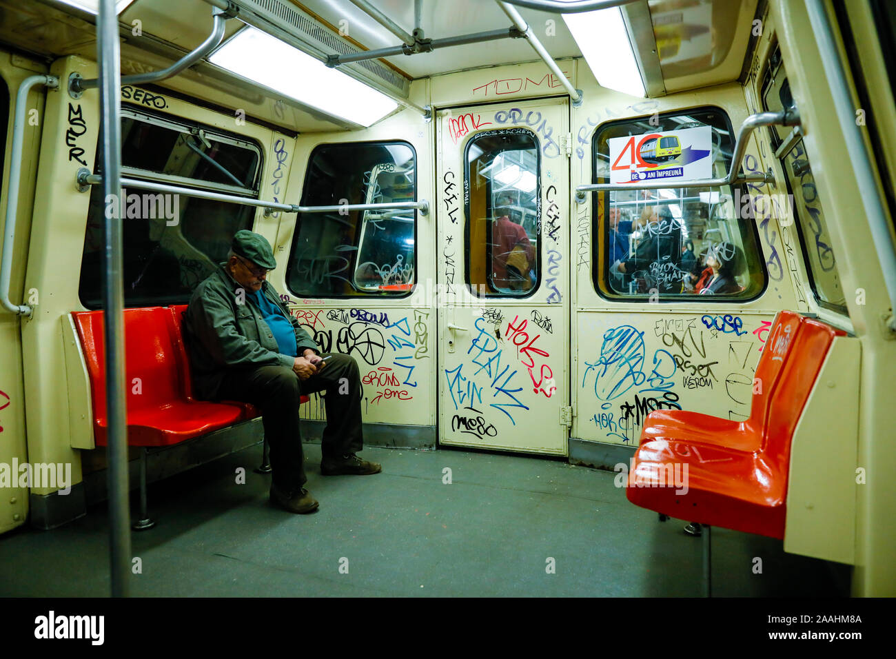 Bucharest, Romania - November 19, 2019: A man is travelling in a dirty ...