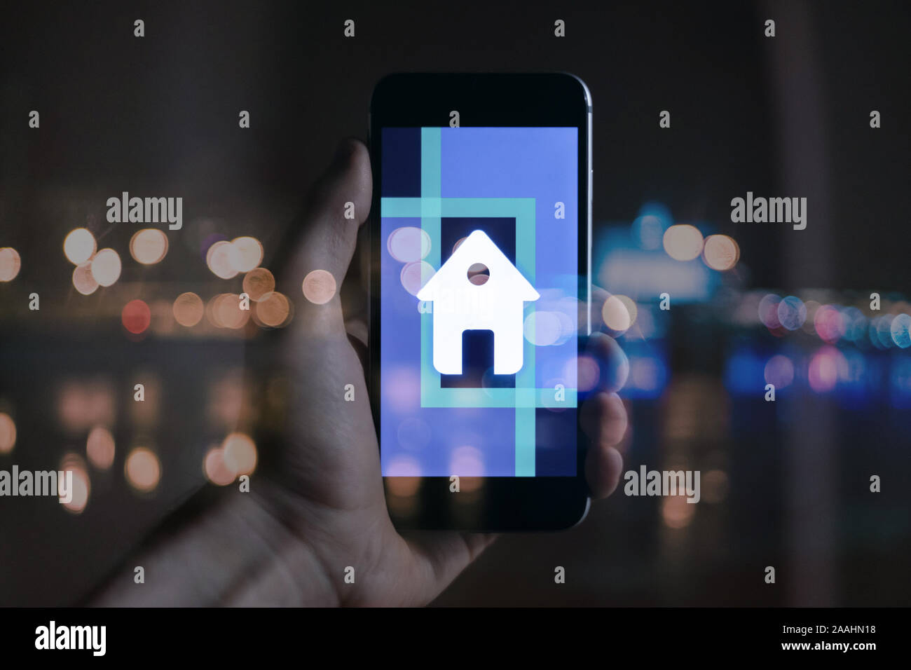 hand holding smartphone with smart home application, modern technology ...