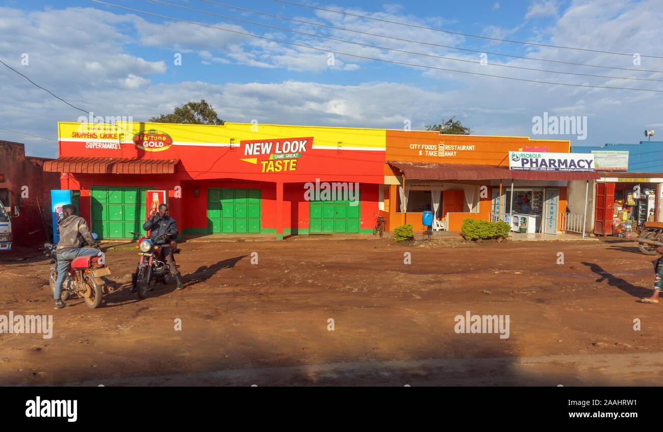 Typical low rise roadside shops and buildings painted with colourful ...