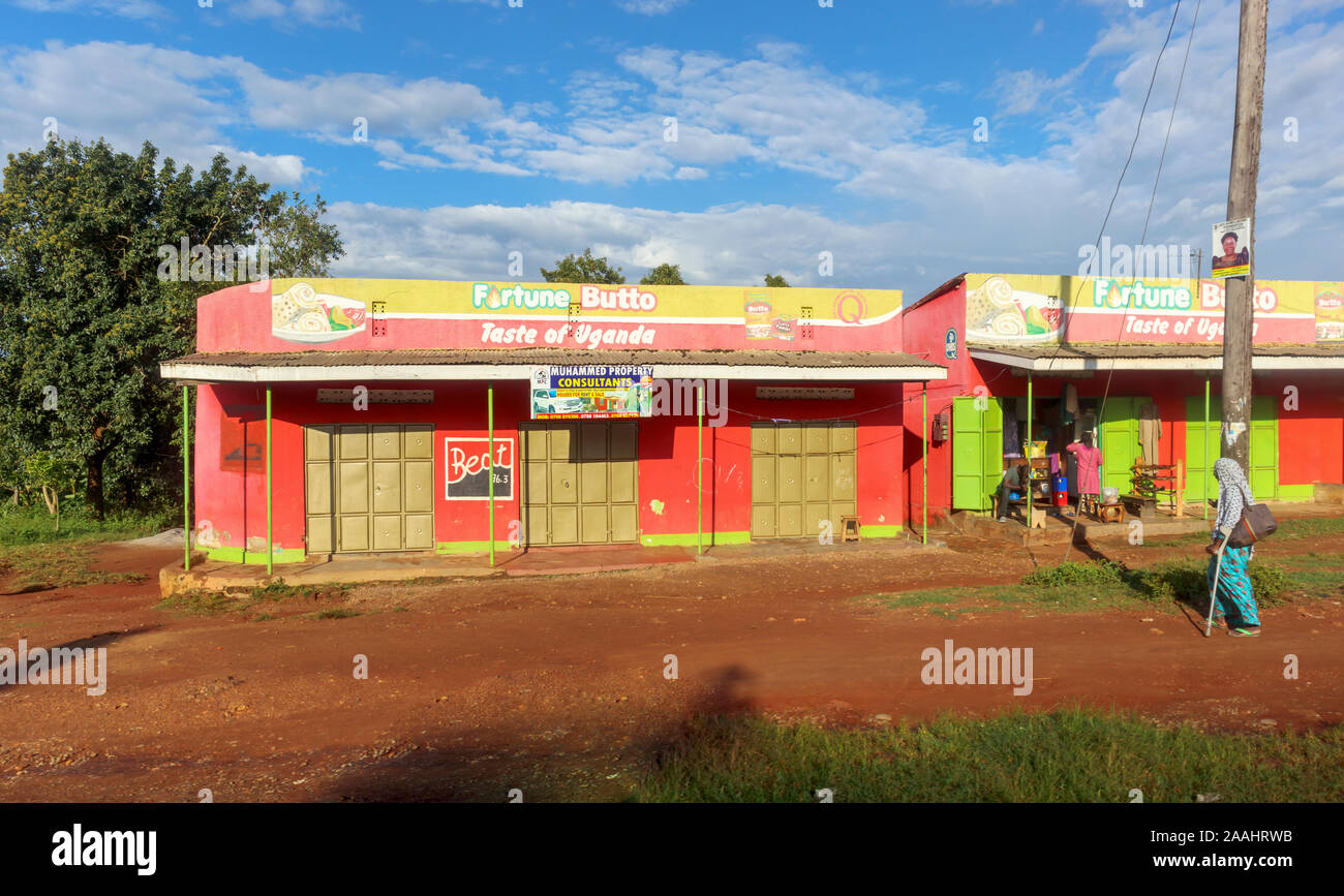 Typical low rise roadside shops and buildings painted with colourful ...