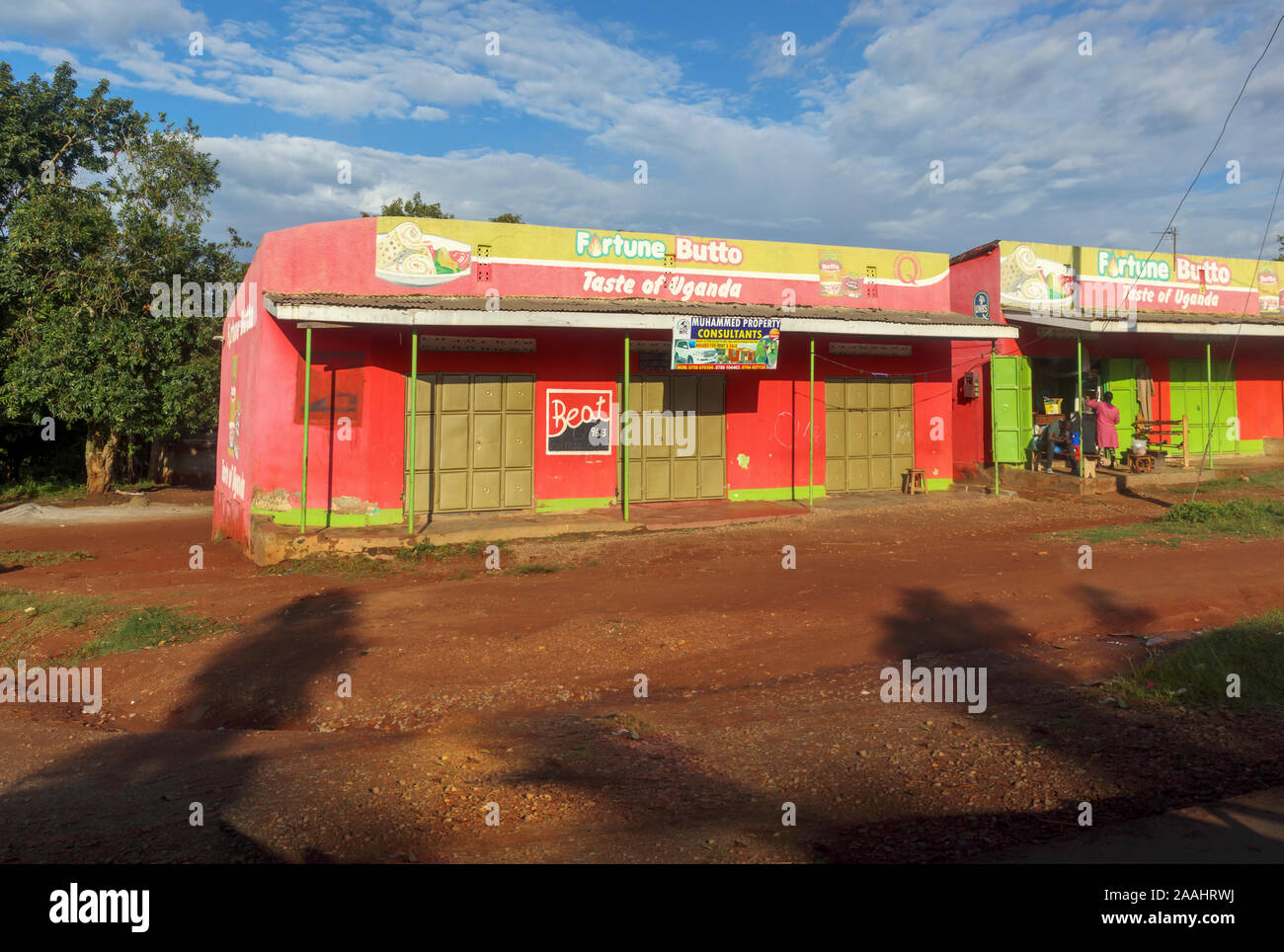 Typical low rise roadside shops and buildings painted with colourful ...