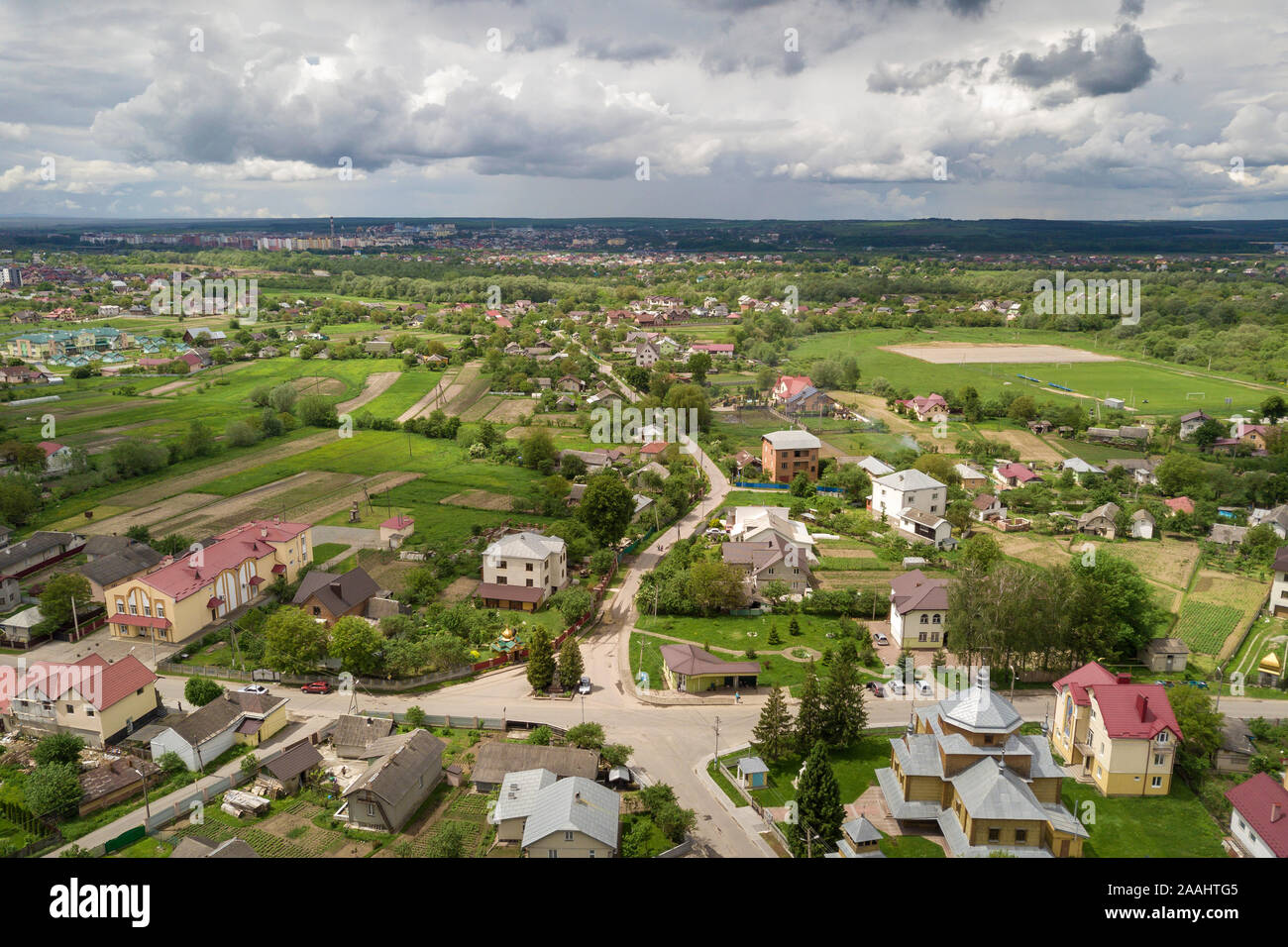 Top down aerial view of town or village with rows of buildings and ...