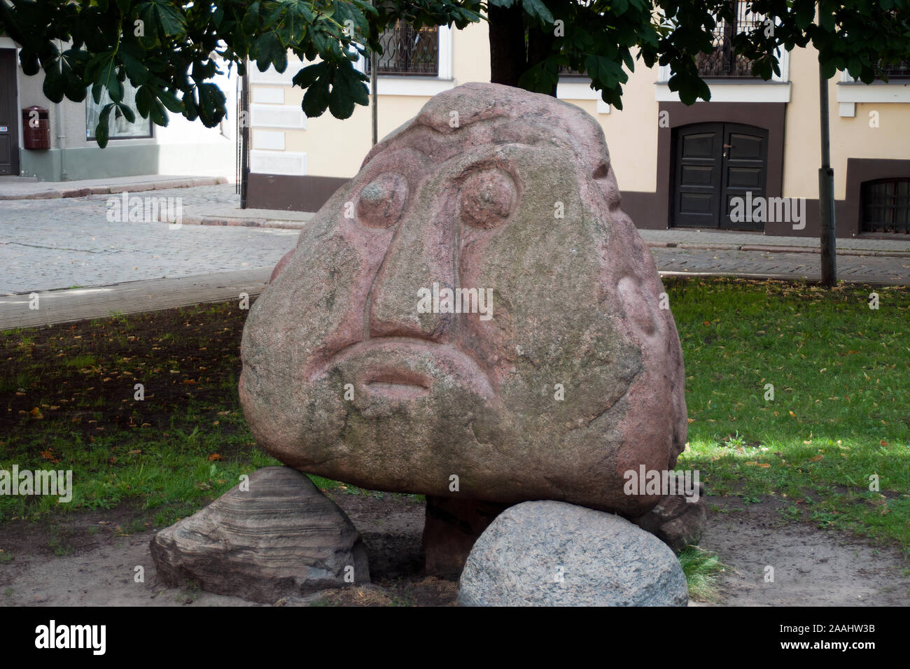 Riga Latvia, Modern stone statue of face in old town street Stock Photo ...