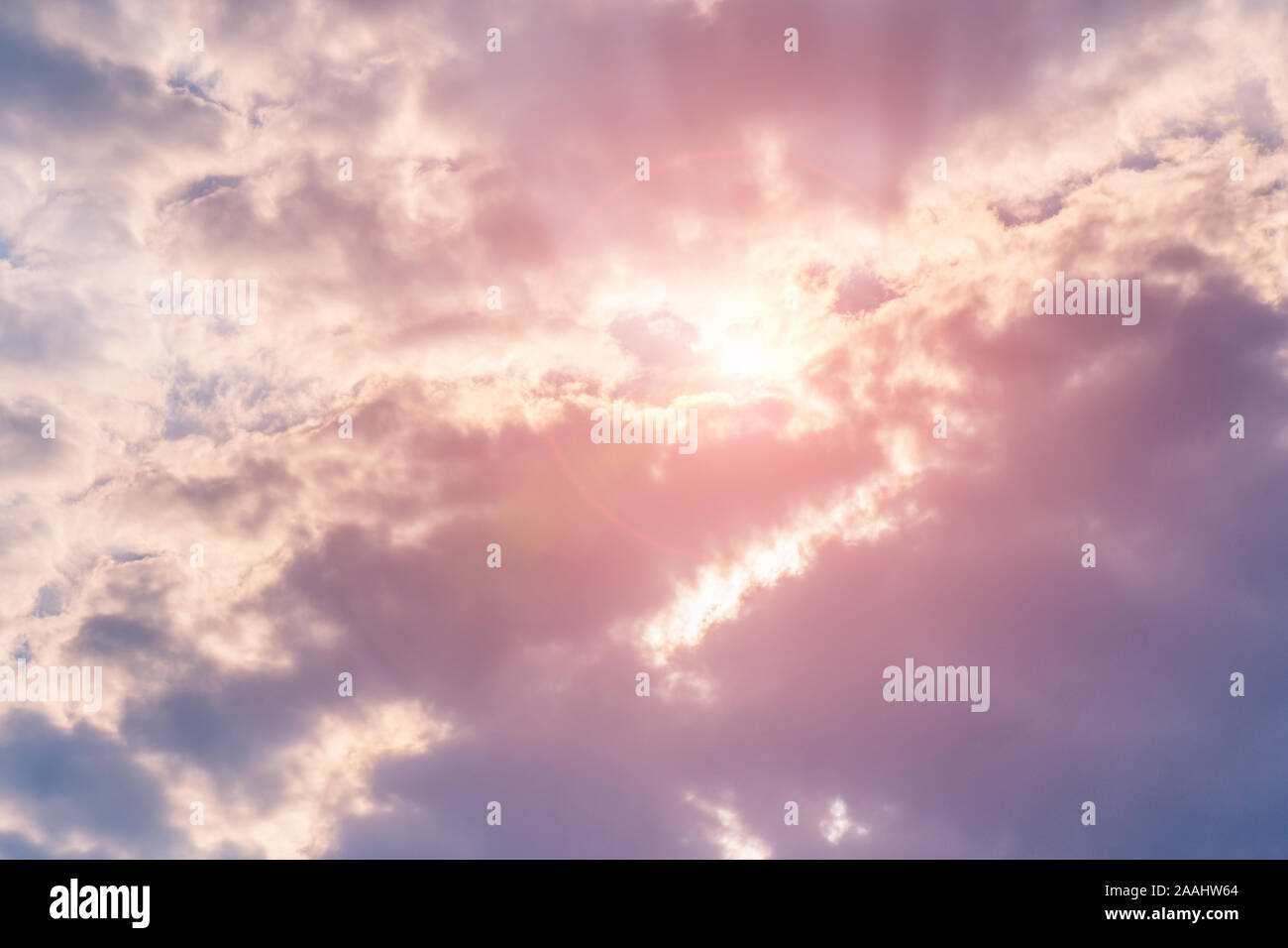 blue clouds on the sky in the rays of sun in the fall. Landscape ...