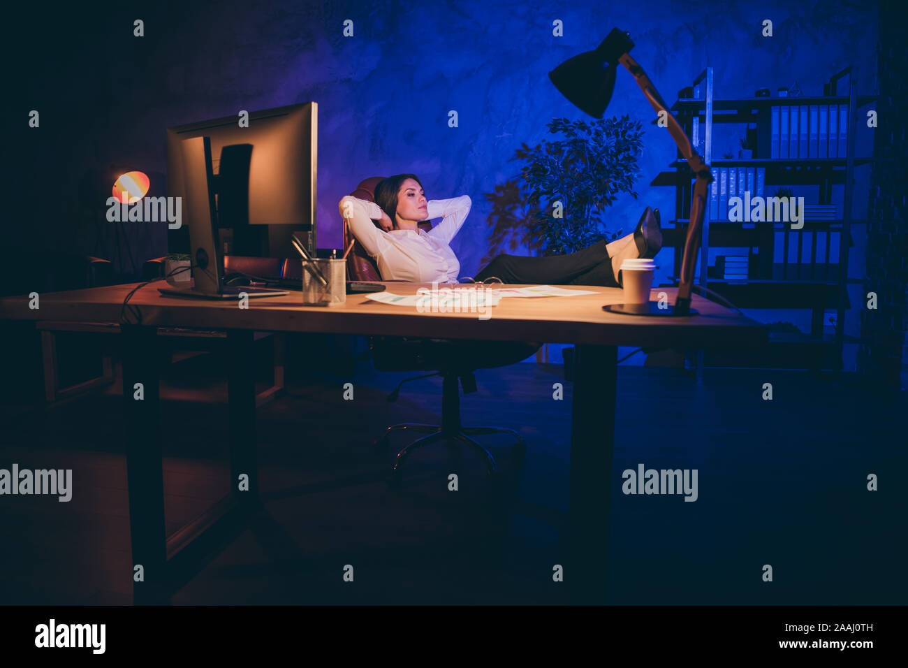 Businesswoman legs up on desk hi-res stock photography and images - Alamy