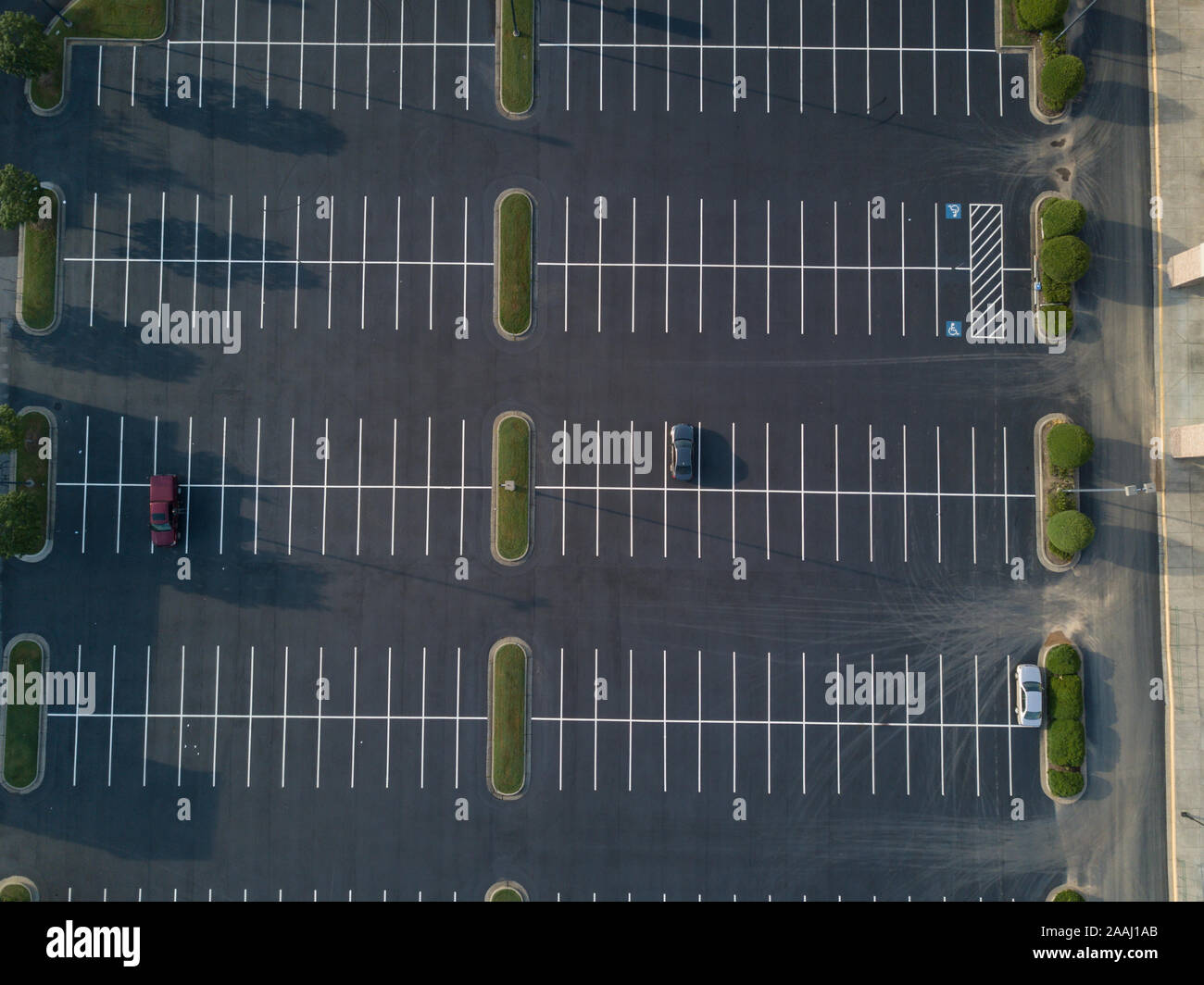 Looking down on a large, mostly empty parking lot Stock Photo - Alamy