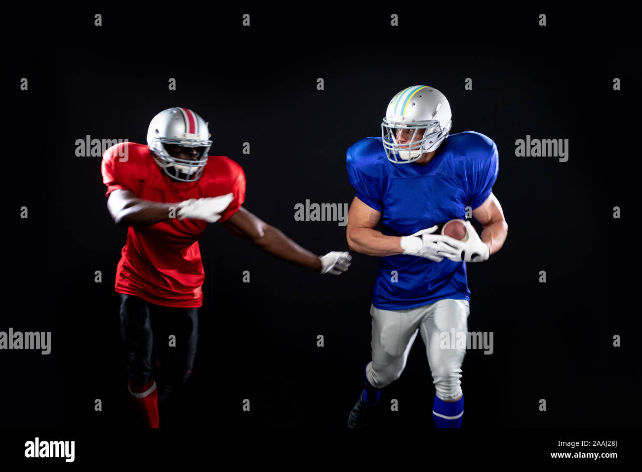 Two American football players in action Stock Photo - Alamy