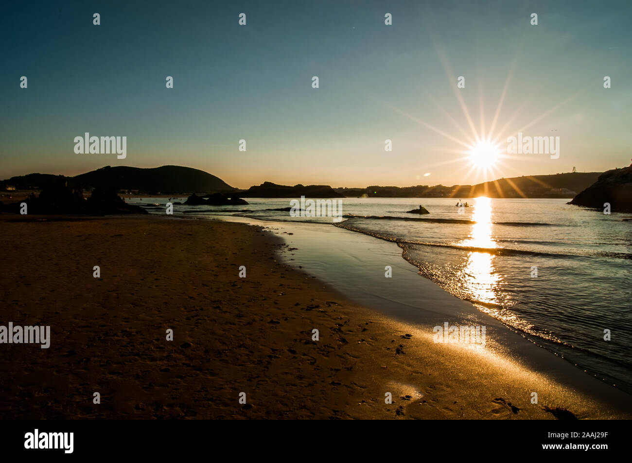 sunset on the beach Stock Photo - Alamy