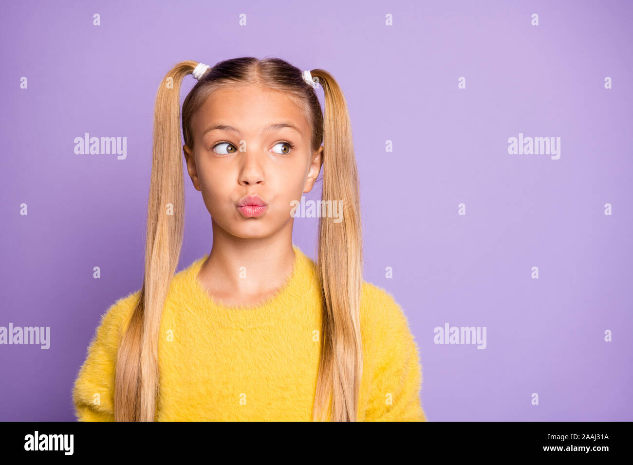 Photo of girl looking into empty space with her lips pouted isolated ...