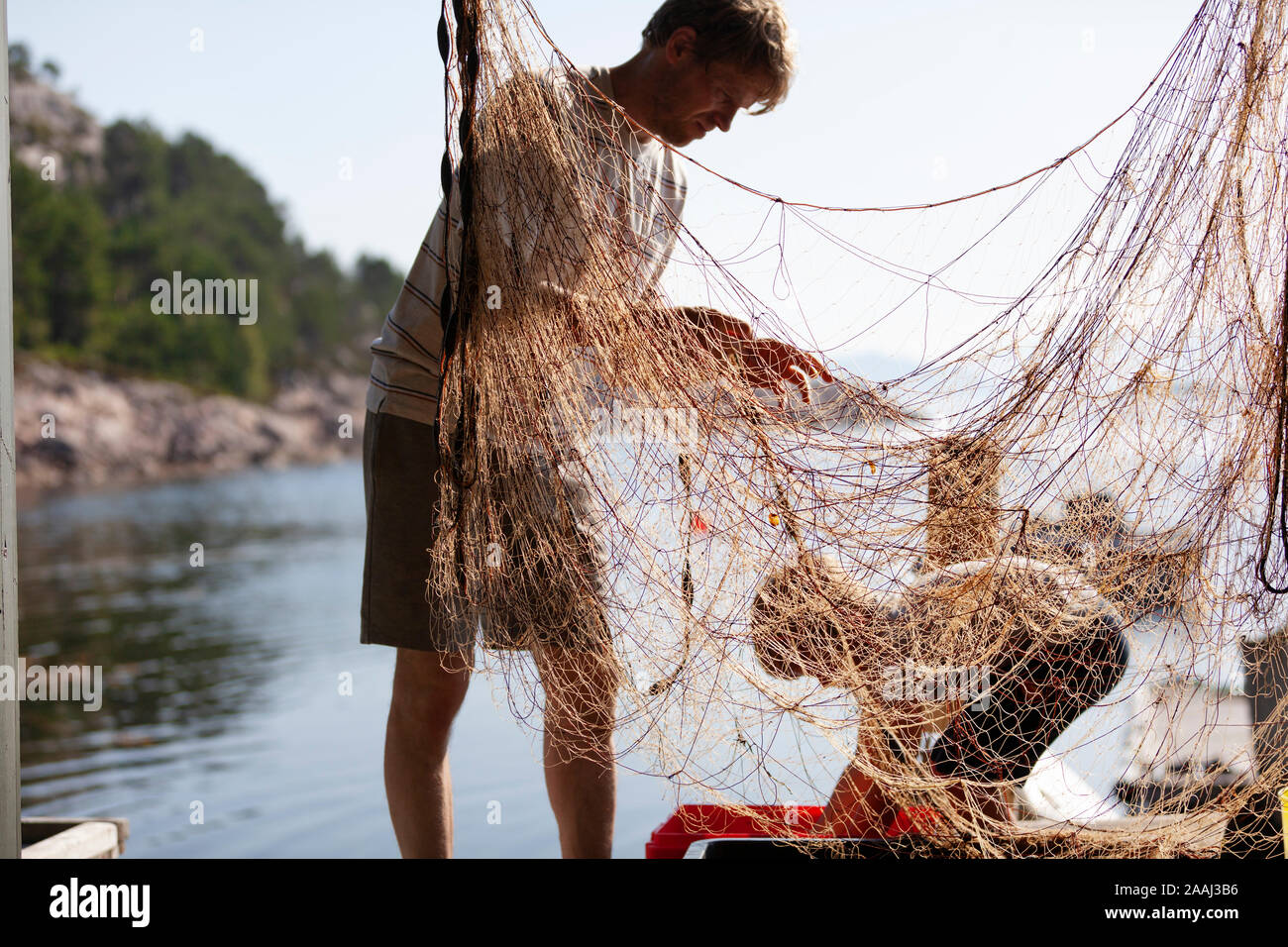Boy with fishing net hi-res stock photography and images - Alamy
