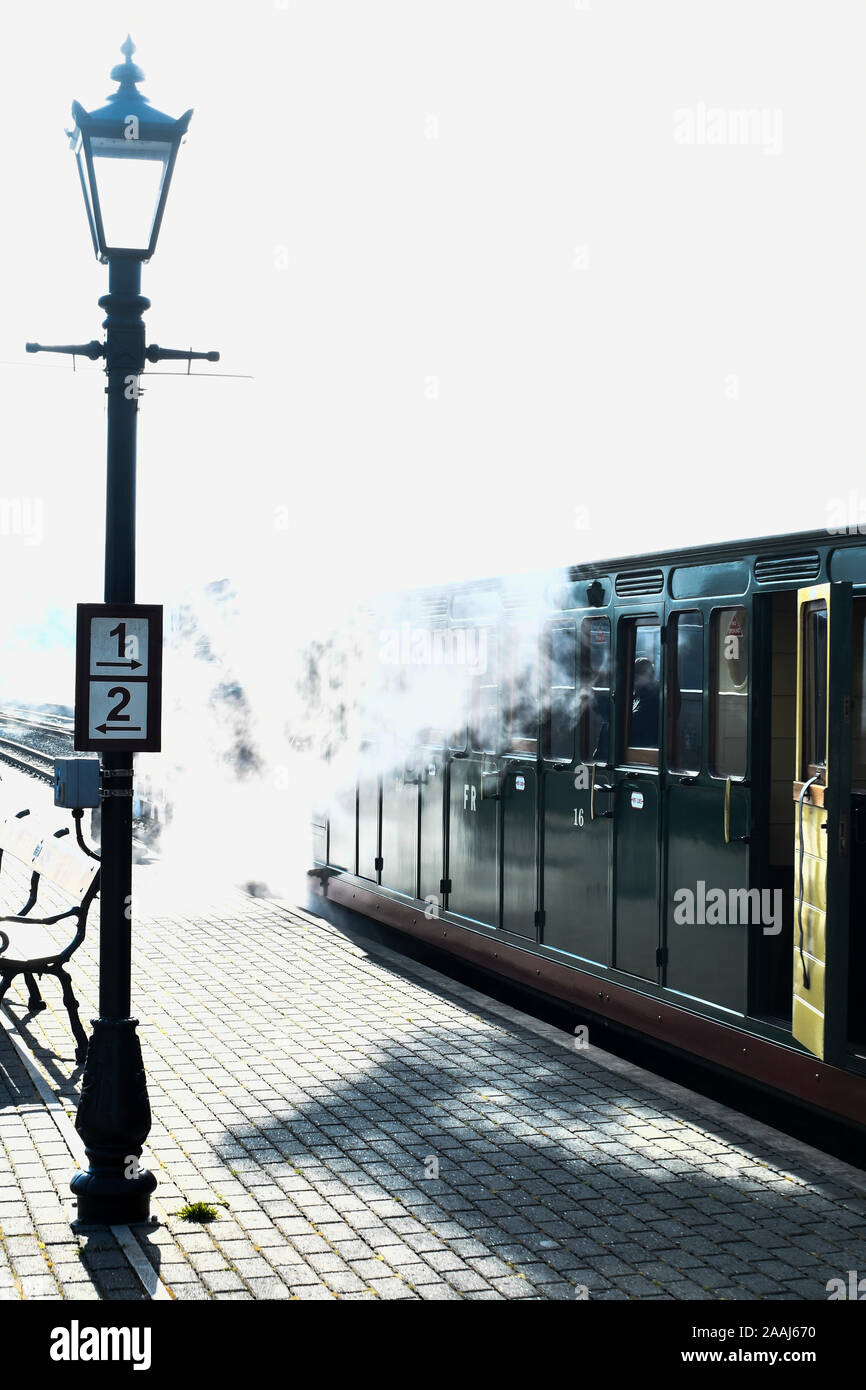 Steam train stopping at station Stock Photo - Alamy