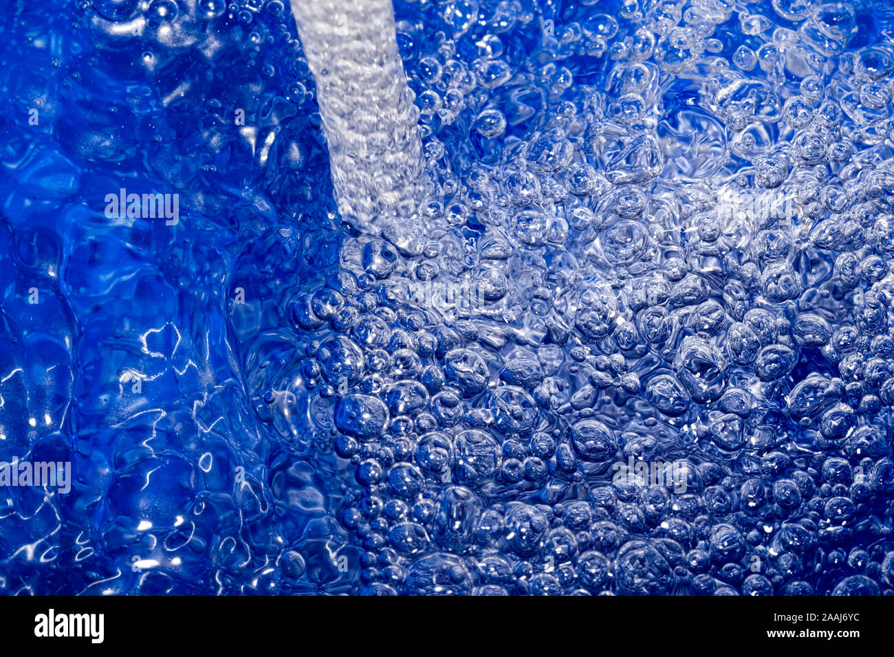 A jet of water generating bubbles Stock Photo - Alamy