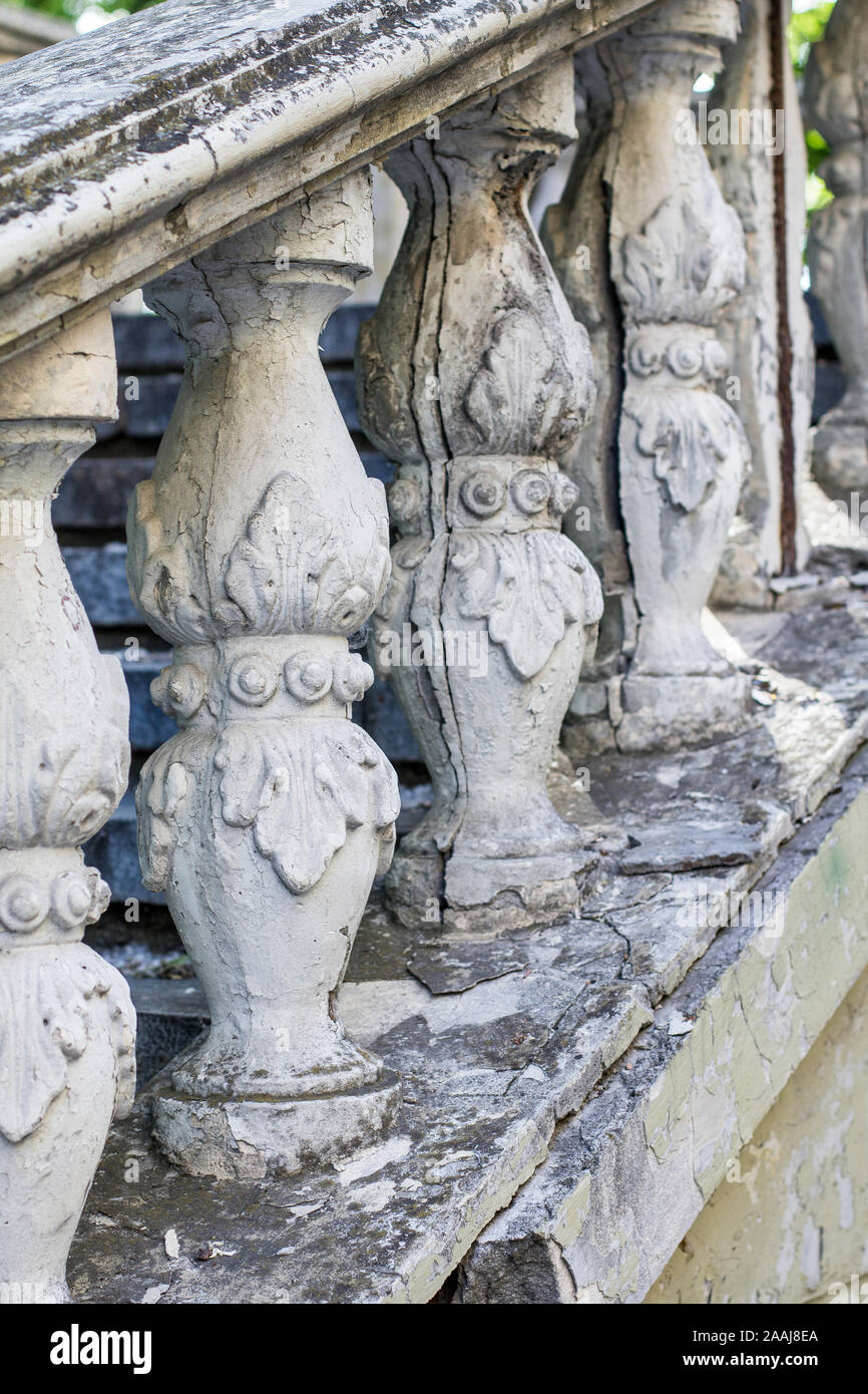 Columns on the old staircase. Railing on the stairs Stock Photo - Alamy