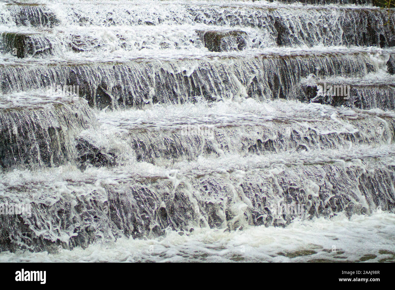 Water Cascading over Weir Steps on canal slipway showing blur blurred ...