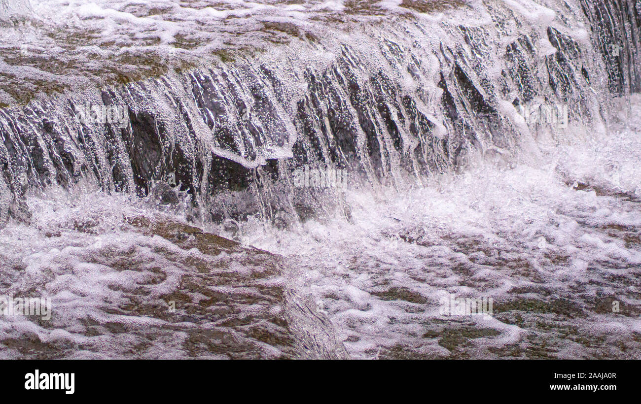 Water Cascading over Weir Steps on canal slipway showing blur blurred ...