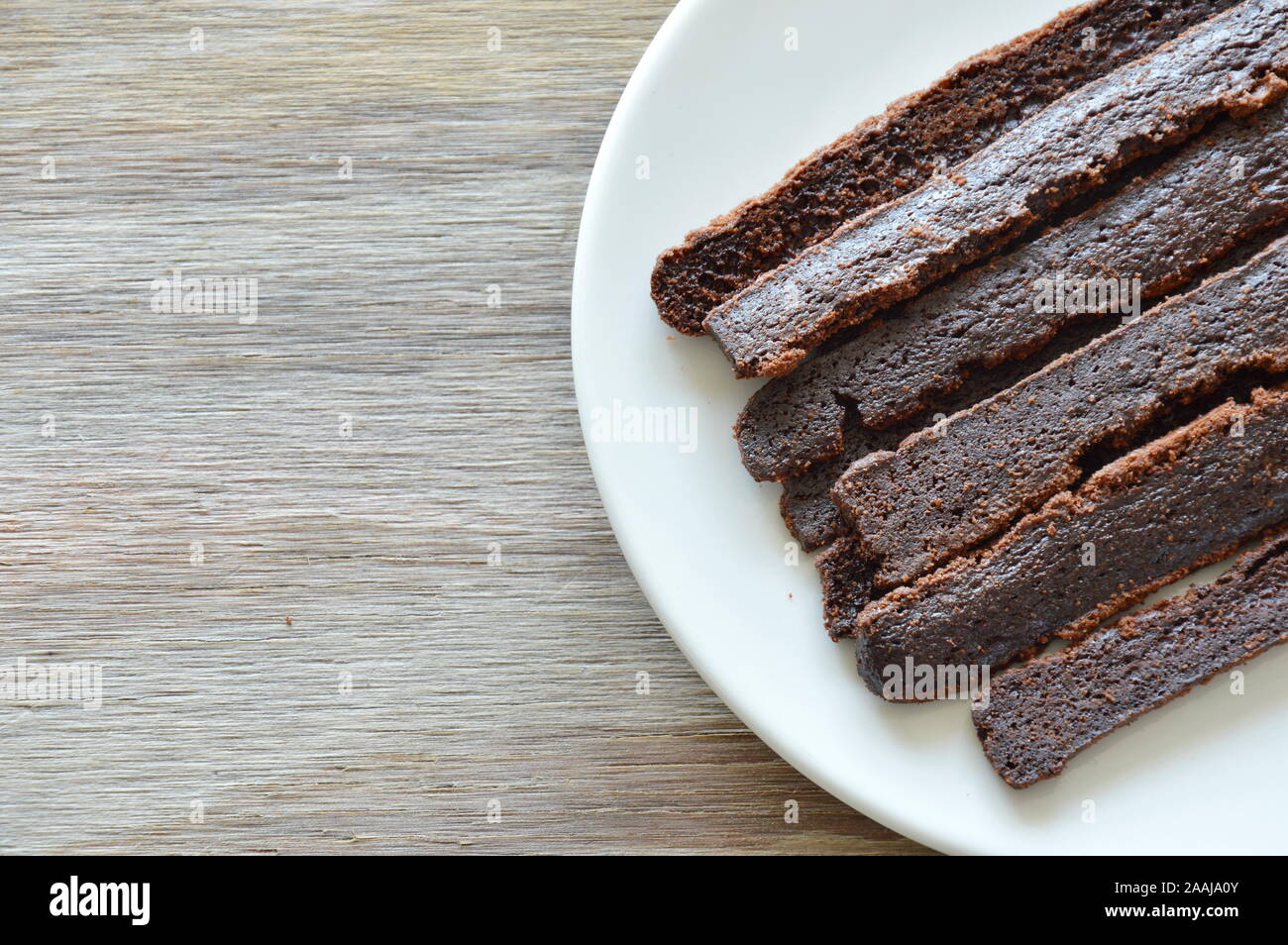 crispy dark chocolate stick bread on dish Stock Photo - Alamy