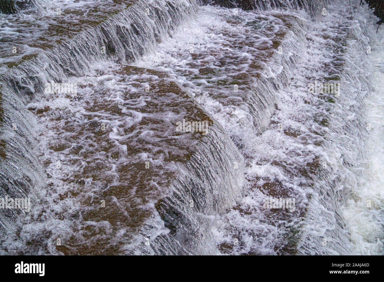 Water Cascading over Weir Steps on canal slipway showing blur blurred ...