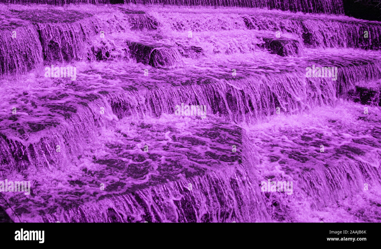 Water Cascading over Weir Steps on canal slipway showing blur blurred ...