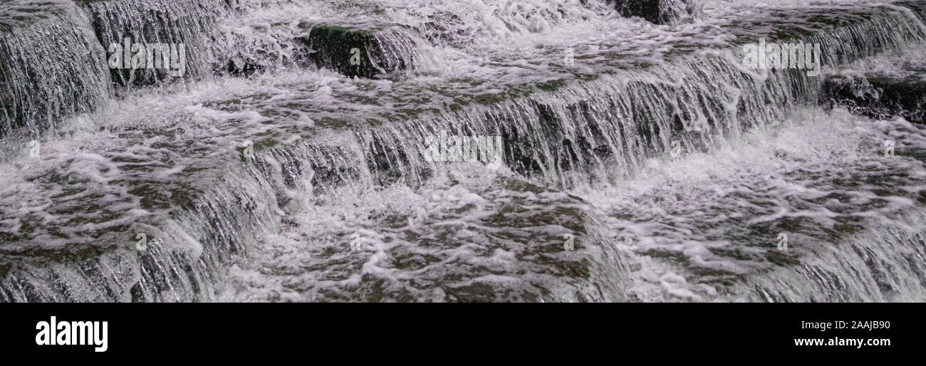 Water Cascading over Weir Steps on canal slipway showing blur blurred ...