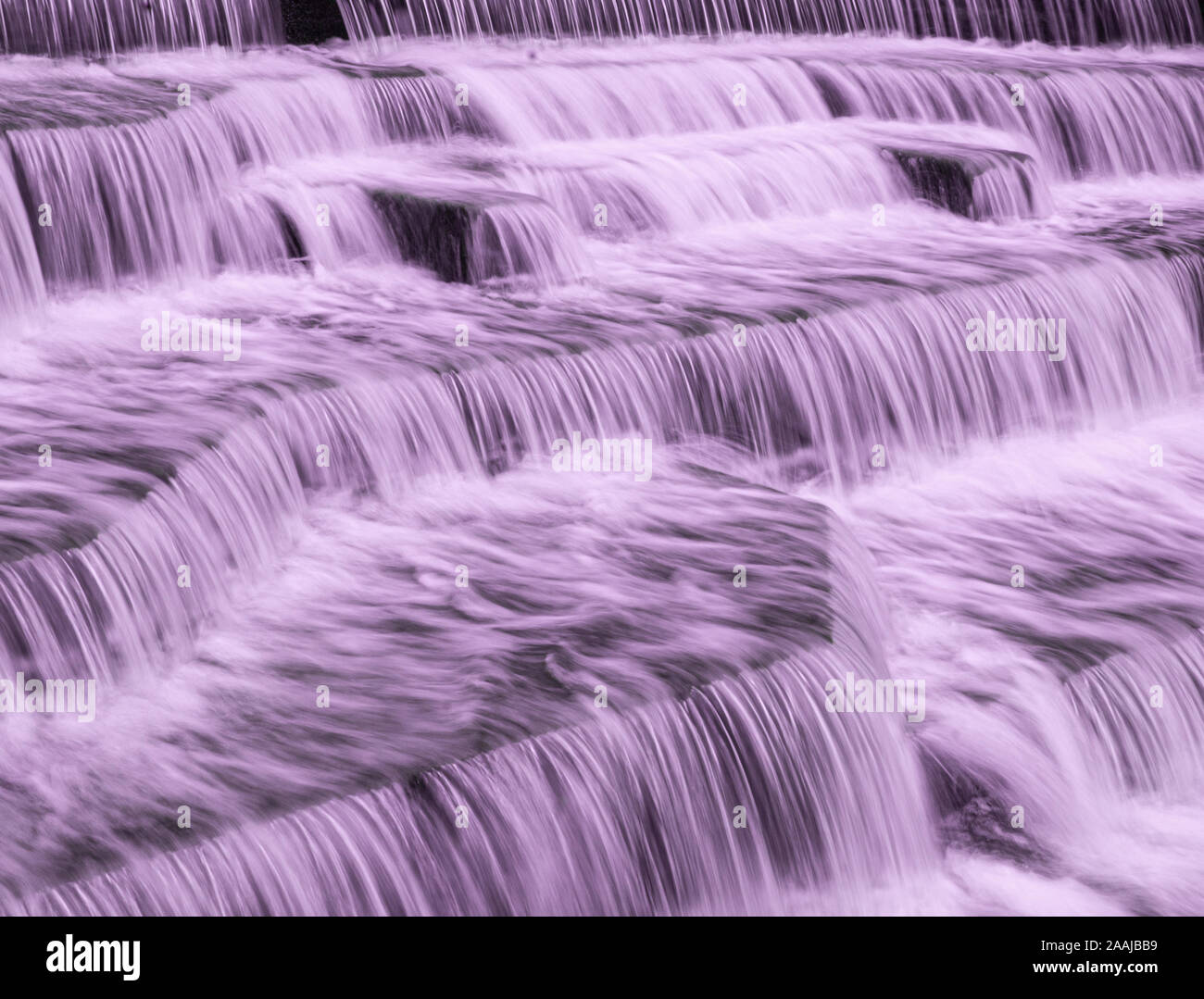 Water Cascading over Weir Steps on canal slipway showing blur blurred ...