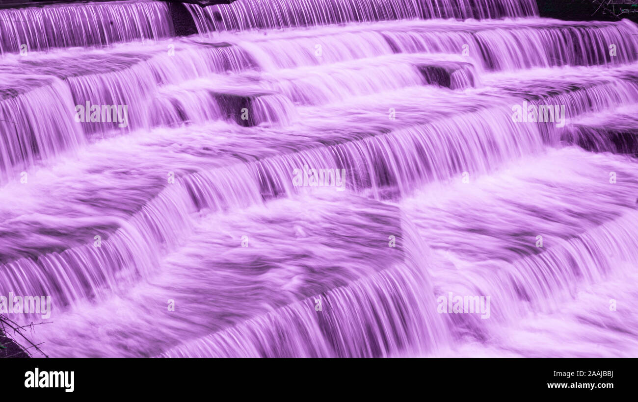 Water Cascading over Weir Steps on canal slipway showing blur blurred ...