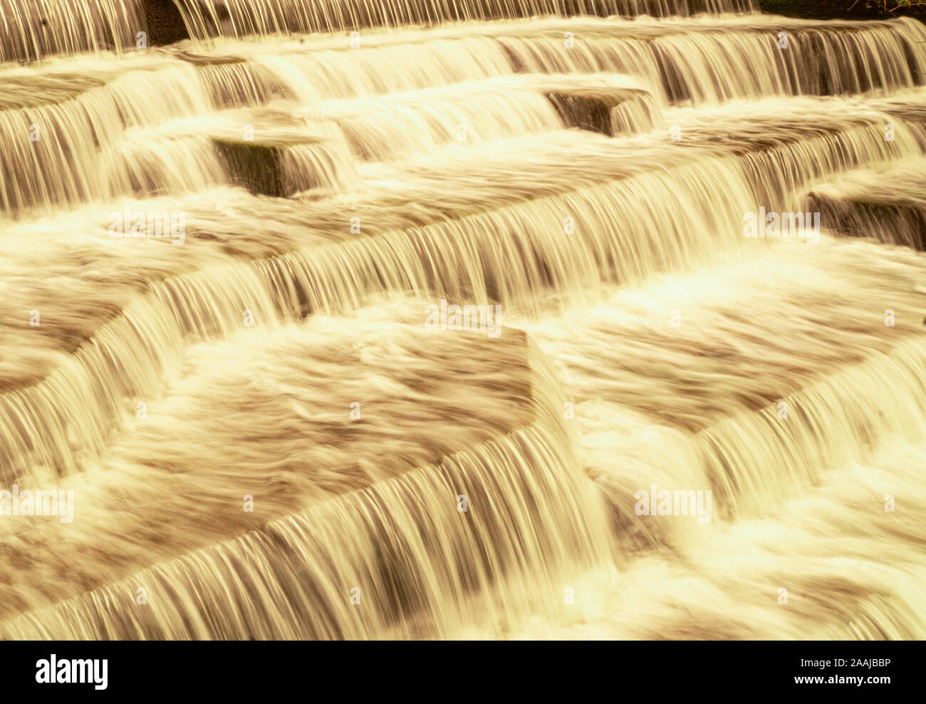 Water Cascading over Weir Steps on canal slipway showing blur blurred ...