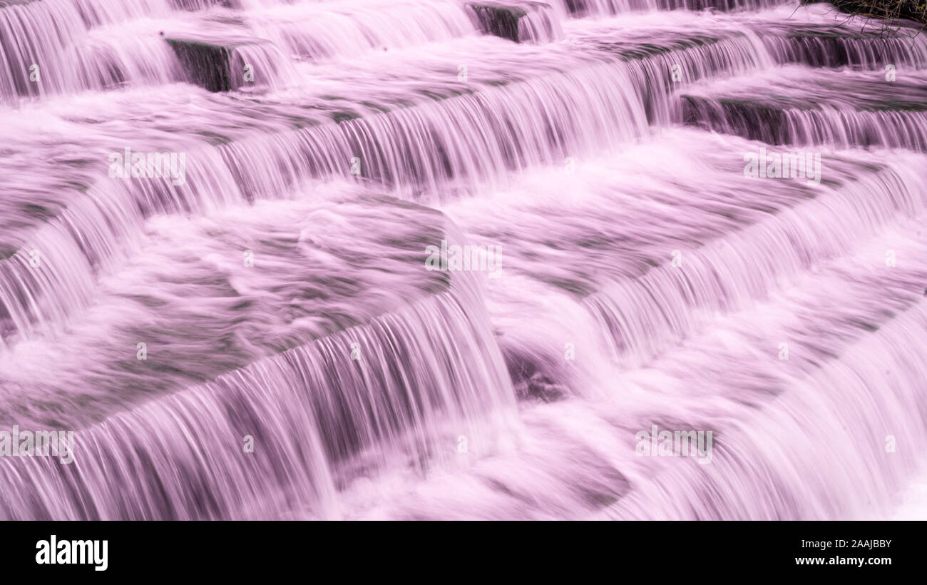 Water Cascading over Weir Steps on canal slipway showing blur blurred ...