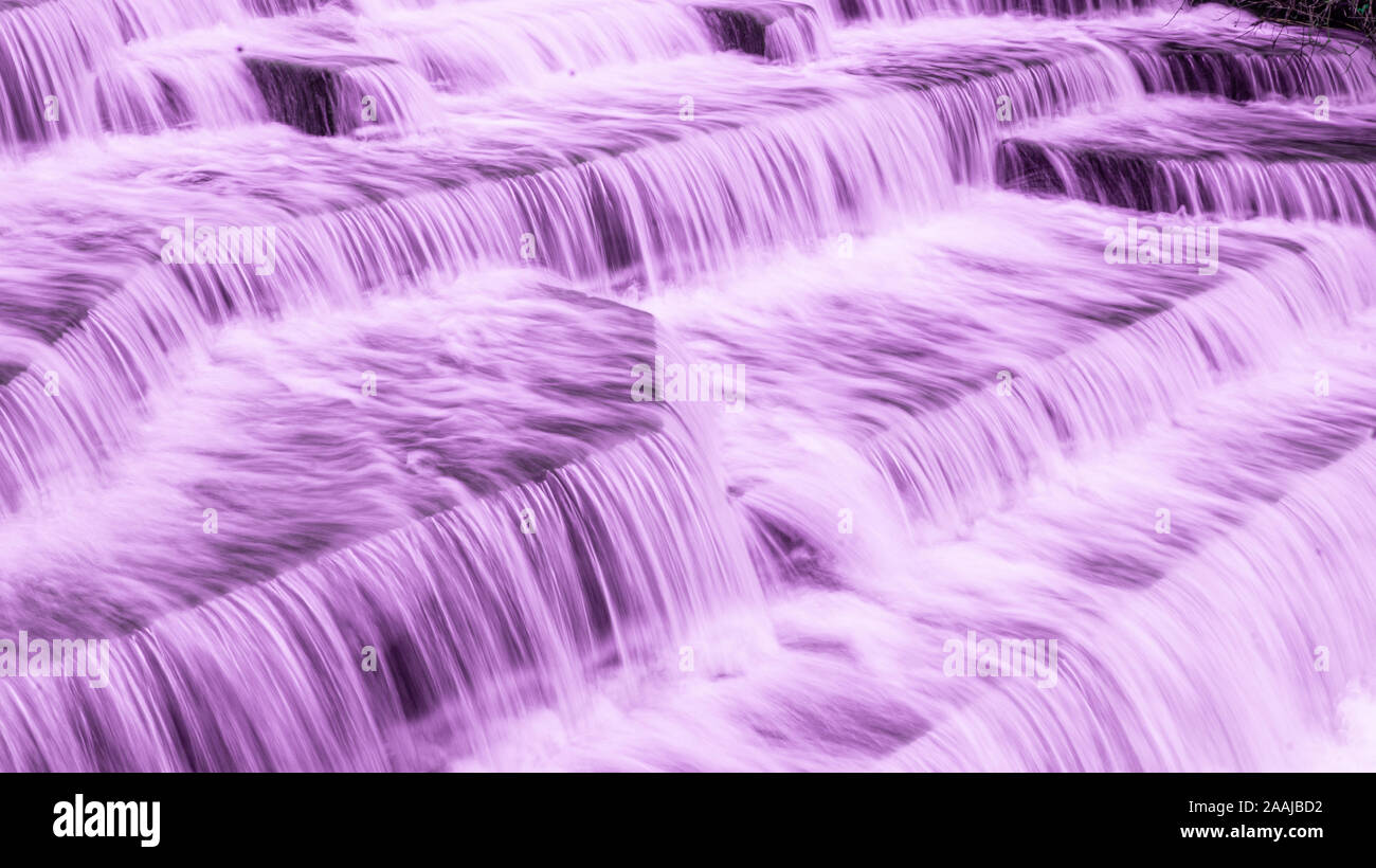 Water Cascading over Weir Steps on canal slipway showing blur blurred ...