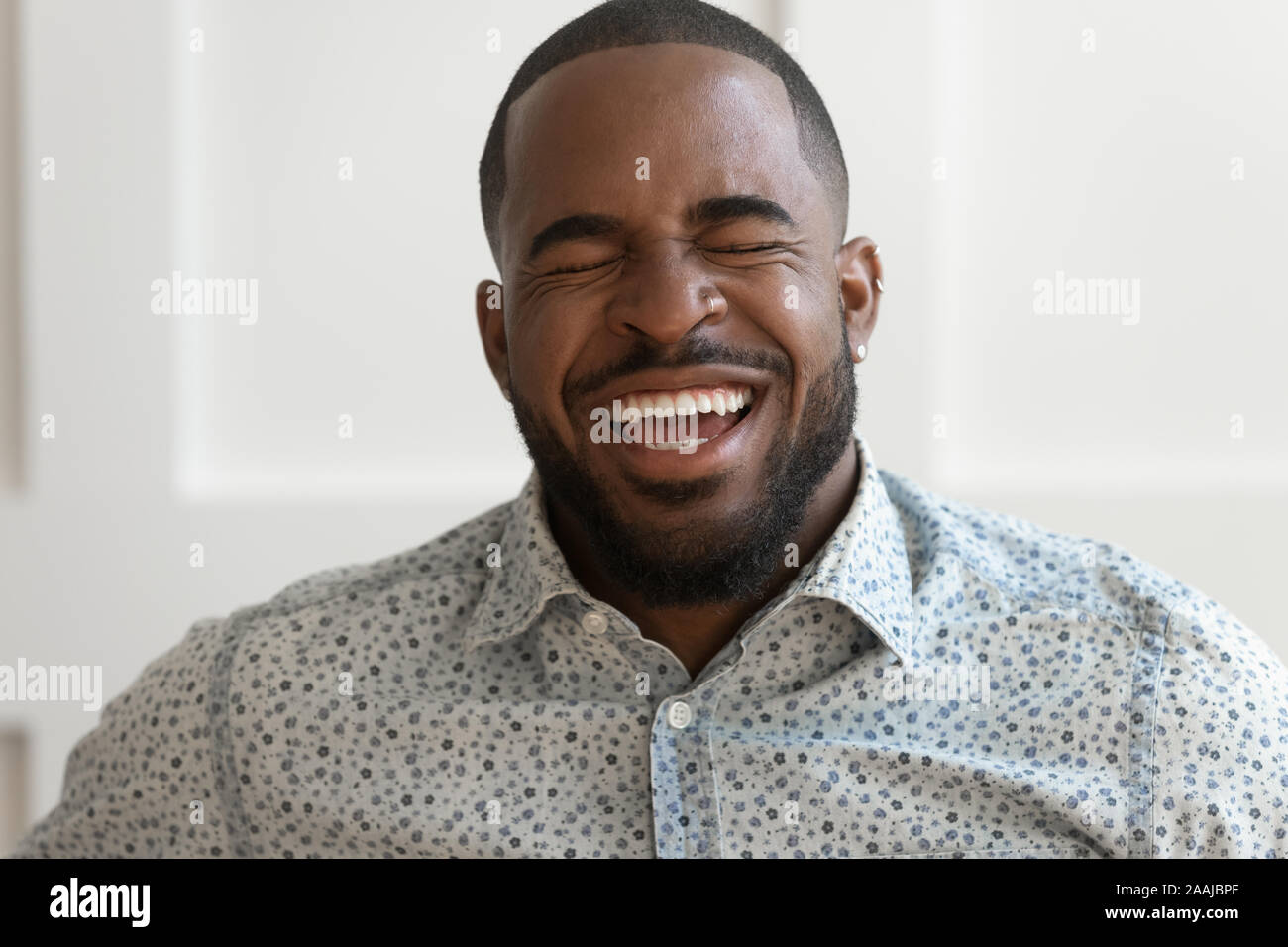 Portrait of excited afrcian American man laughing showing teeth Stock ...
