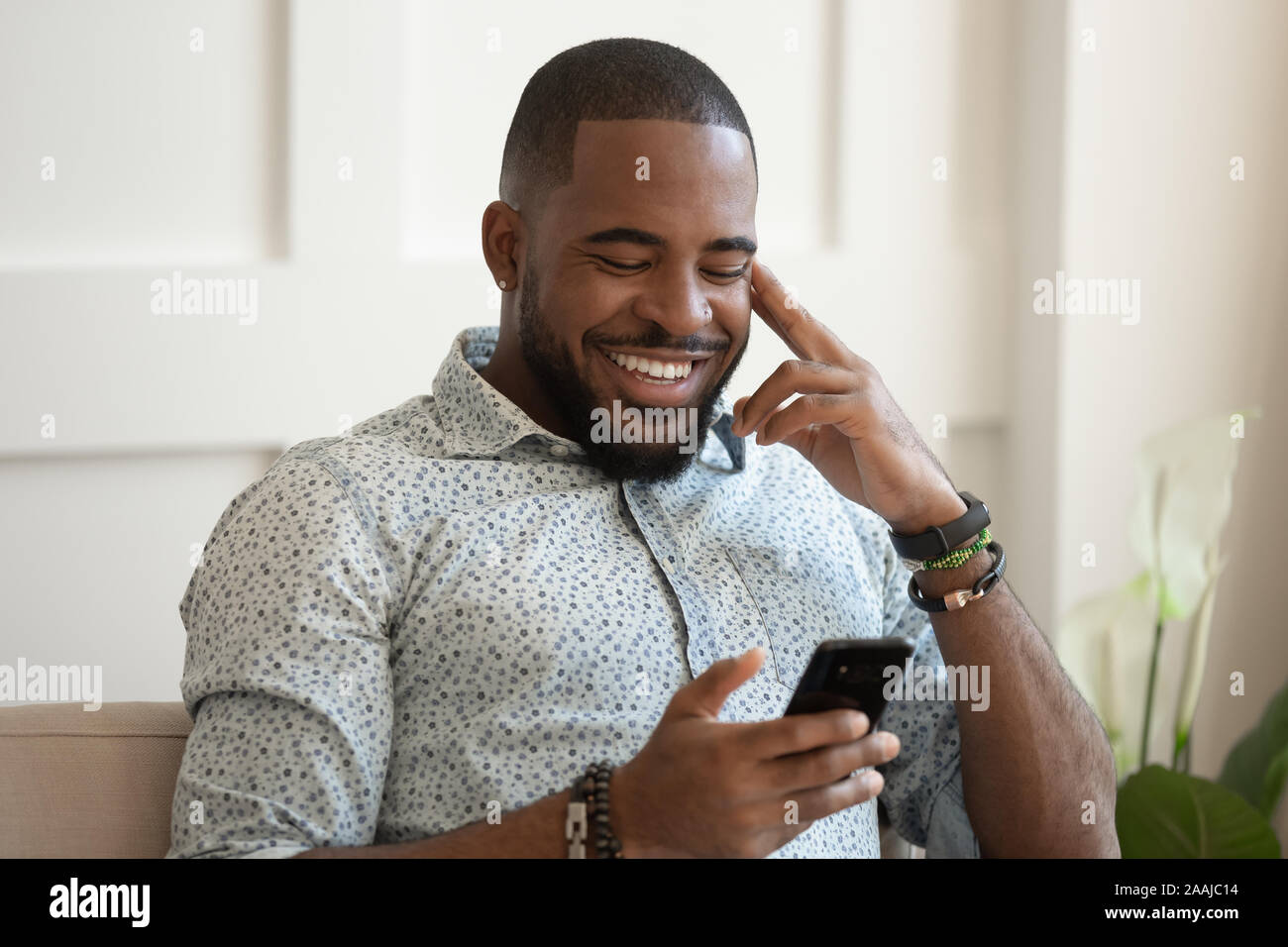 Funny man texting on smartphone hi-res stock photography and images - Alamy