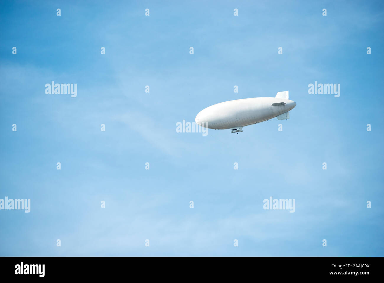 zeppelin on the blue sky in summer time Stock Photo - Alamy