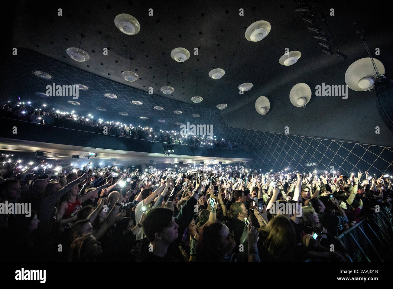 Oslo, Norway. 17th, November 2019. Concert goers raise their smart ...