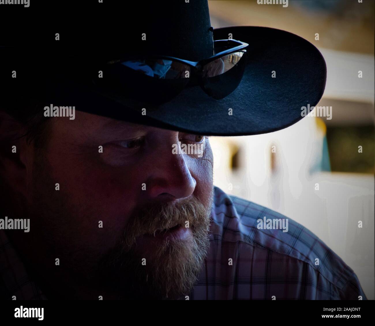 Cowboy farmer with hat in his 40's at family event Stock Photo - Alamy