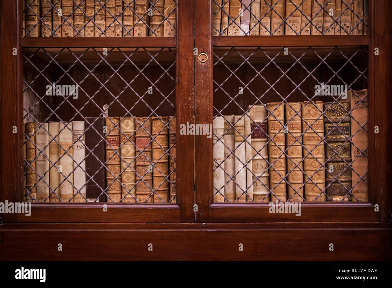 Ancient wooden library in Italy with old books Stock Photo - Alamy