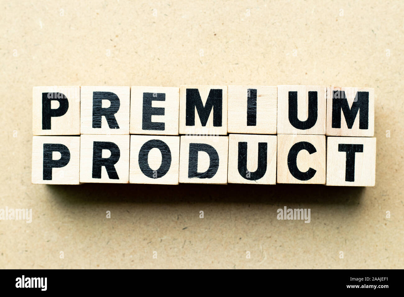 Letter block in word premium product on wood background Stock Photo - Alamy