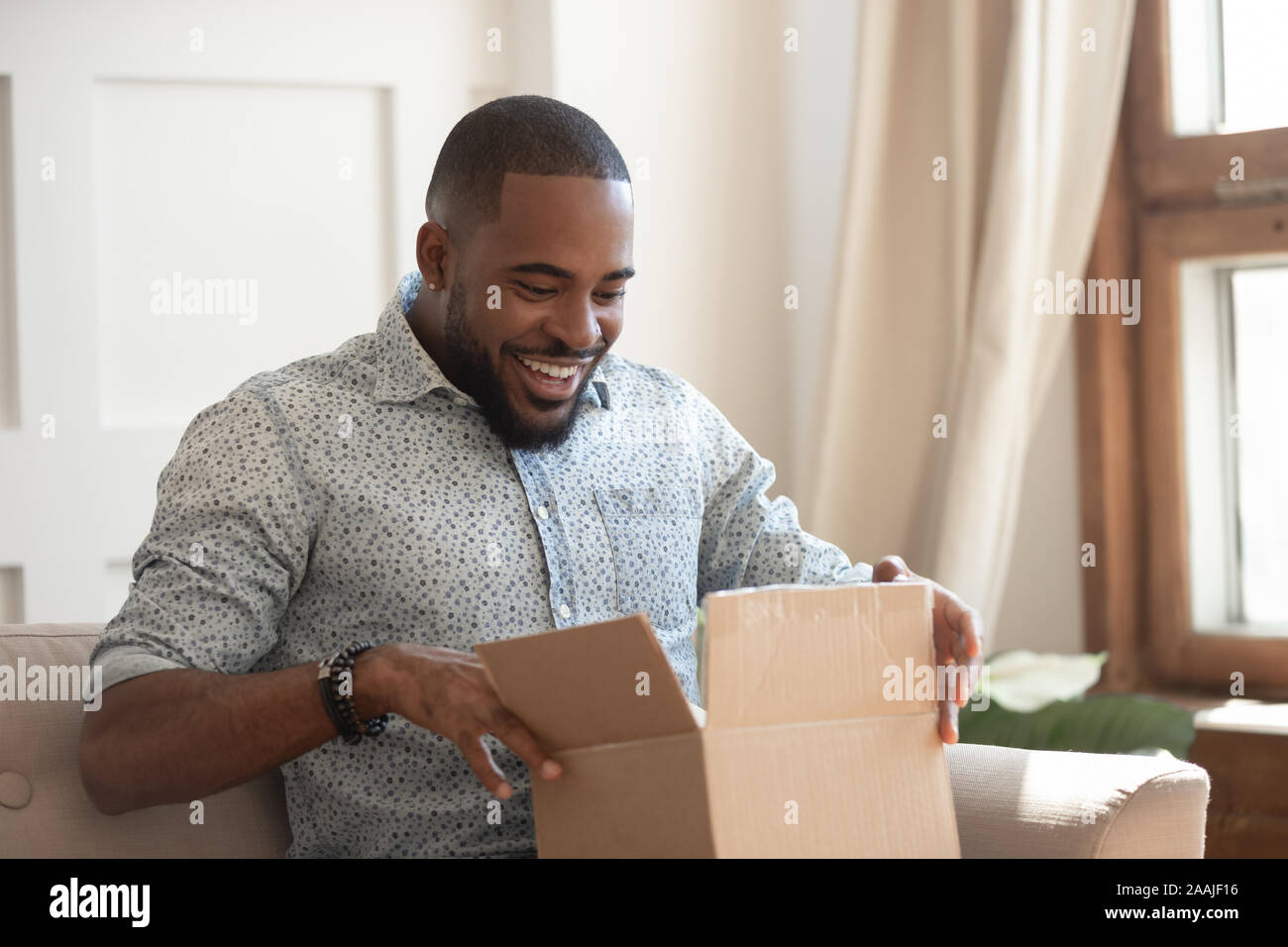 Unpacking the package hi-res stock photography and images - Alamy