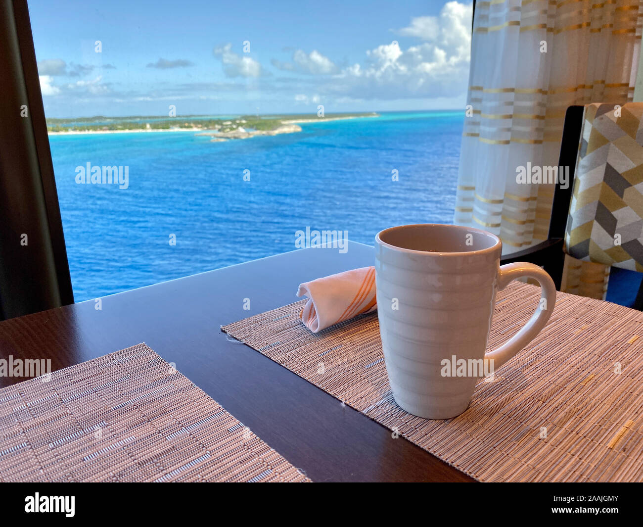 Coffee on a table aboard a cruise ship overlooking the beautiful ...