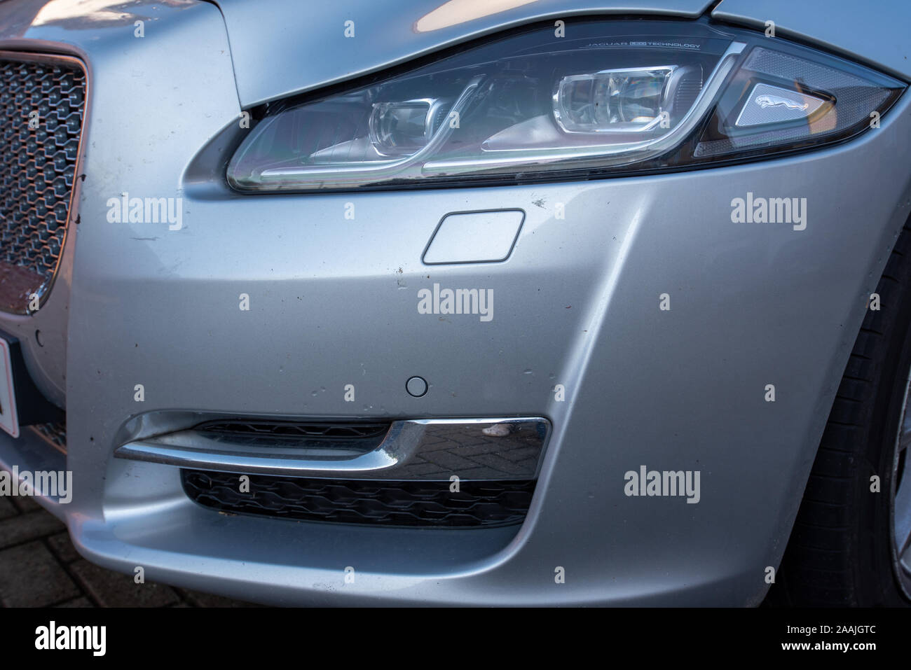 Car Crash: Damage and close up details, silver Jaguar. Road traffic ...
