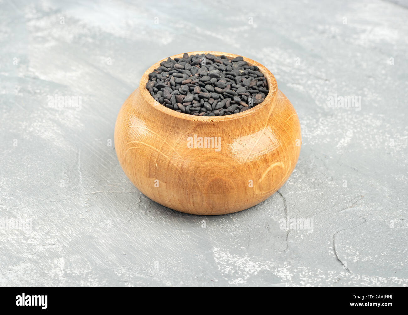 Black sesame in a wooden container on a light background Stock Photo ...