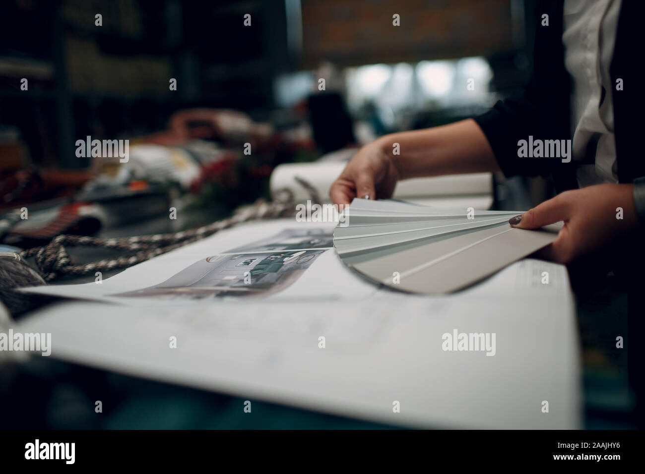 Interior design concept. Designer hands and project Stock Photo - Alamy