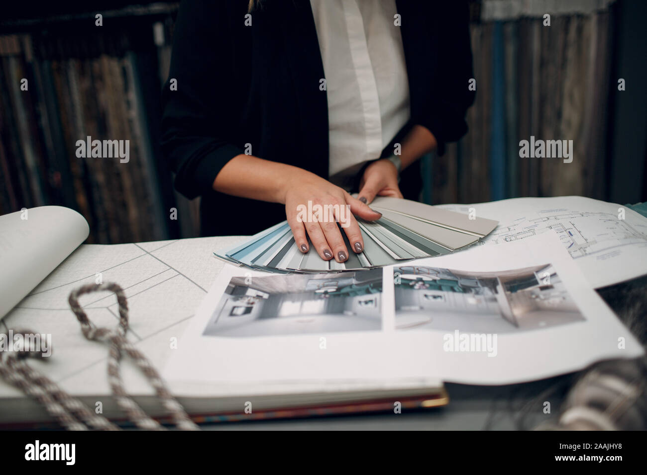 Interior design concept. Designer hands and project Stock Photo - Alamy