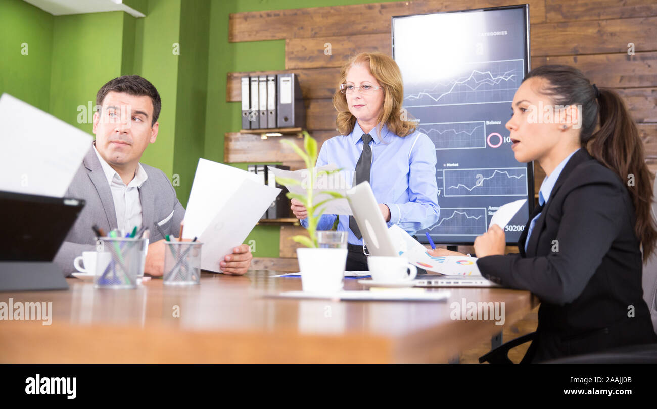 Business woman making a presentation in a conference room with charts ...