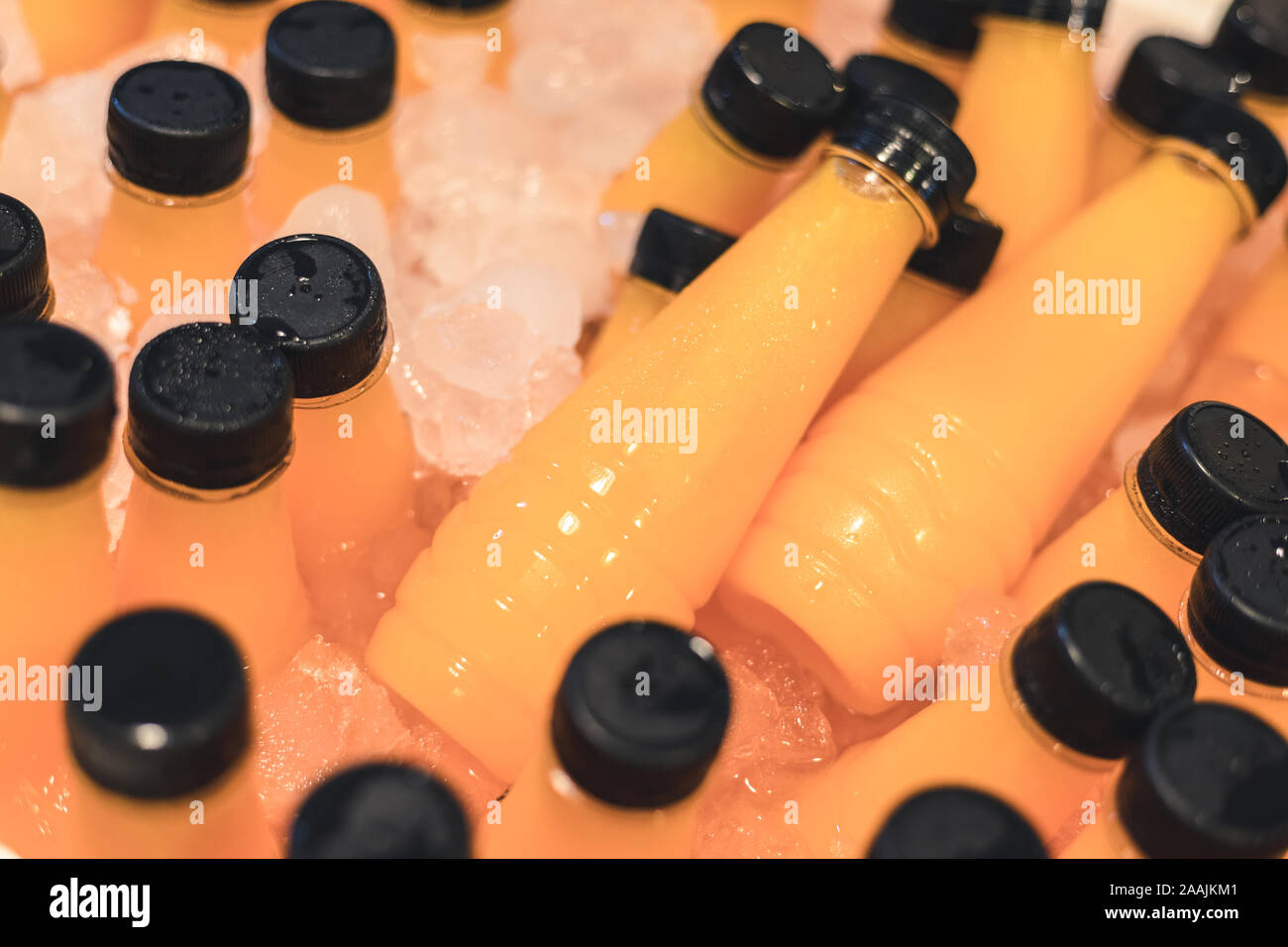 orange juice 100 percent fill up in small long bottle and freezing on ...
