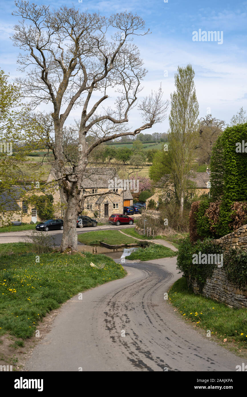 Cute traditional limestone stone houses in rural Britain, England ...