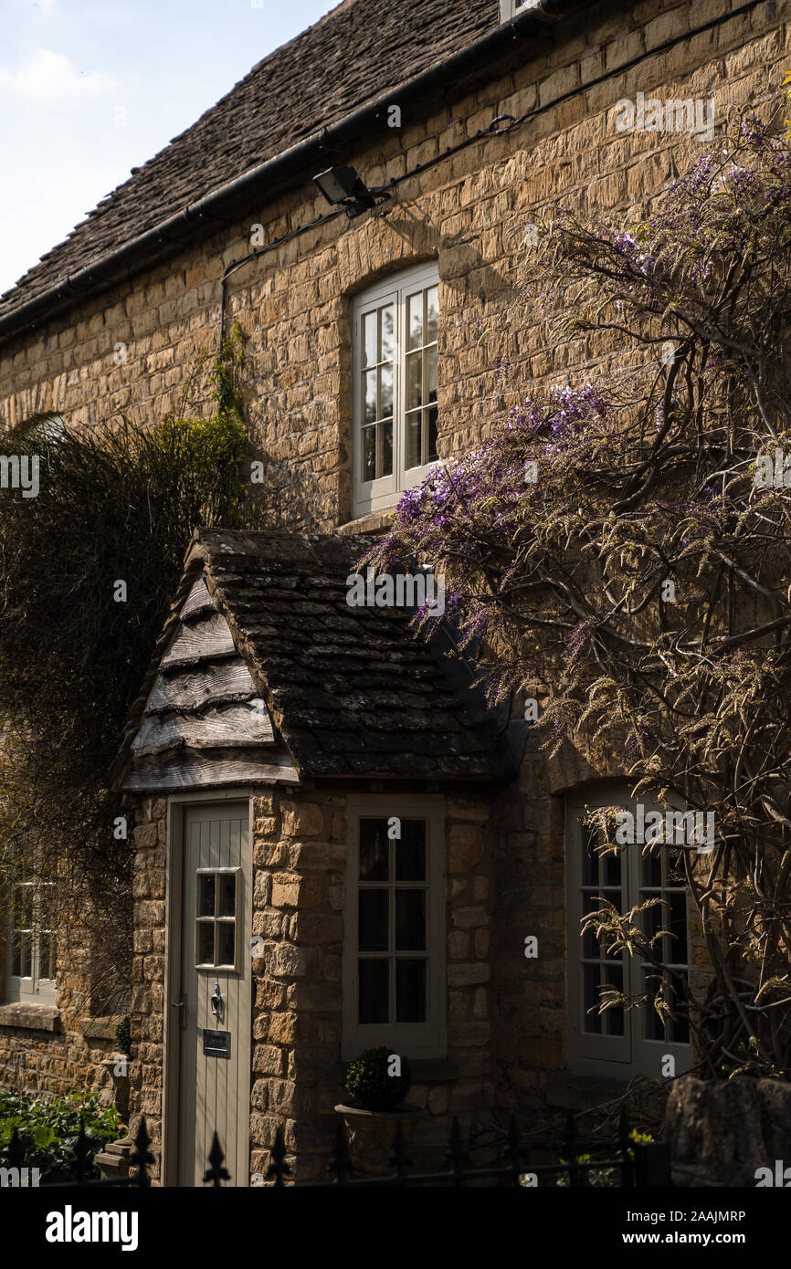 Cute traditional limestone stone houses in rural Britain, England ...