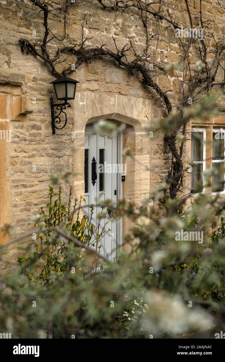 Cute traditional limestone stone houses in rural Britain, England ...
