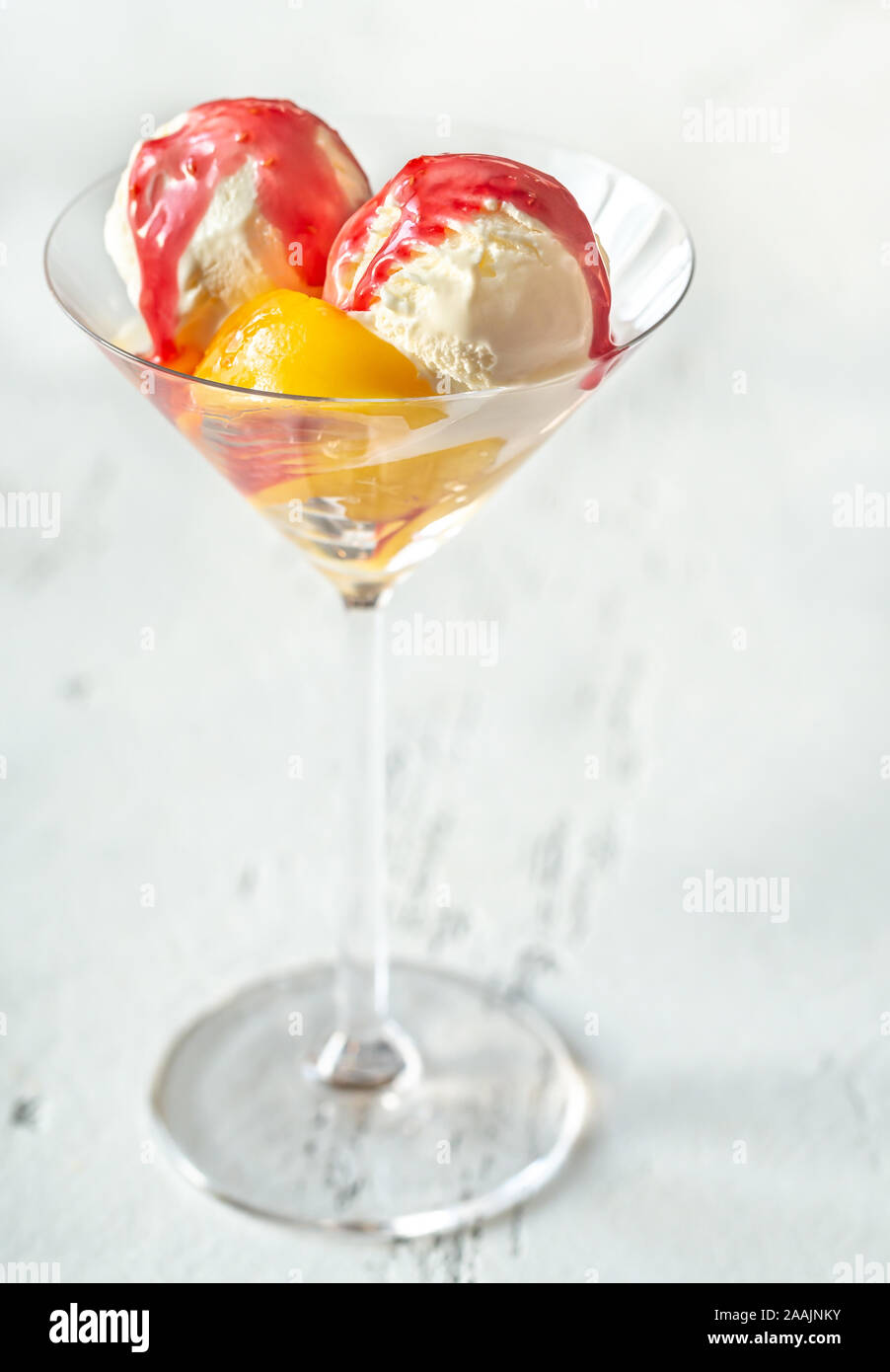 Peach Melba - dessert of peaches and raspberry sauce with vanilla ice ...