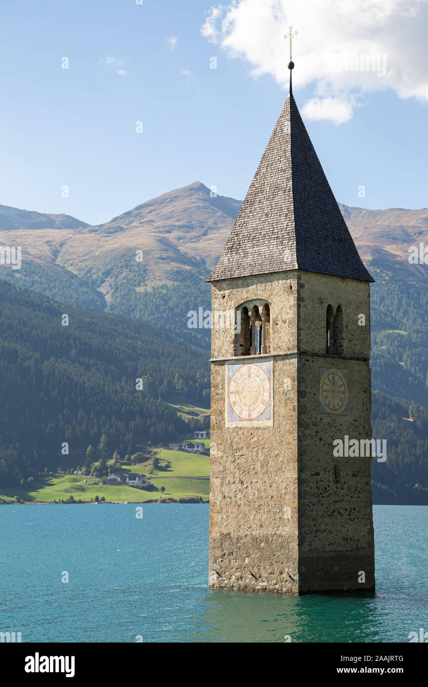 The bell tower submerged by the water in the Resia lake. Alps, Italy ...